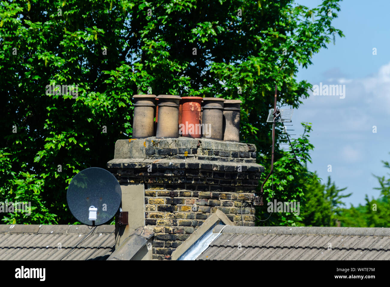 Typical English chimneys on the roofs of London buildings, an element ...