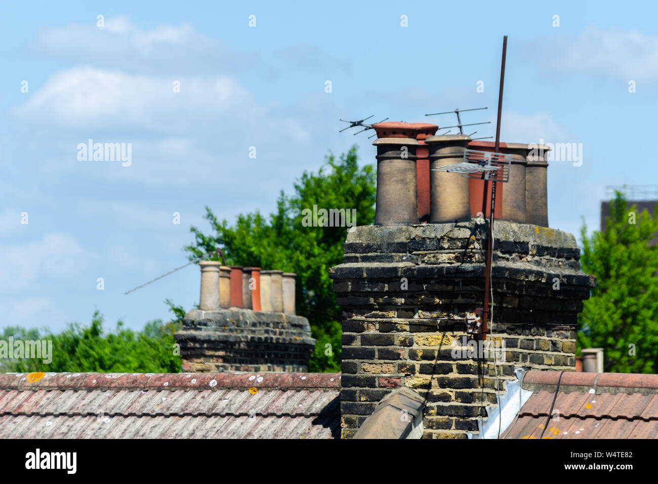 Typical English chimneys on the roofs of London buildings, an element ...