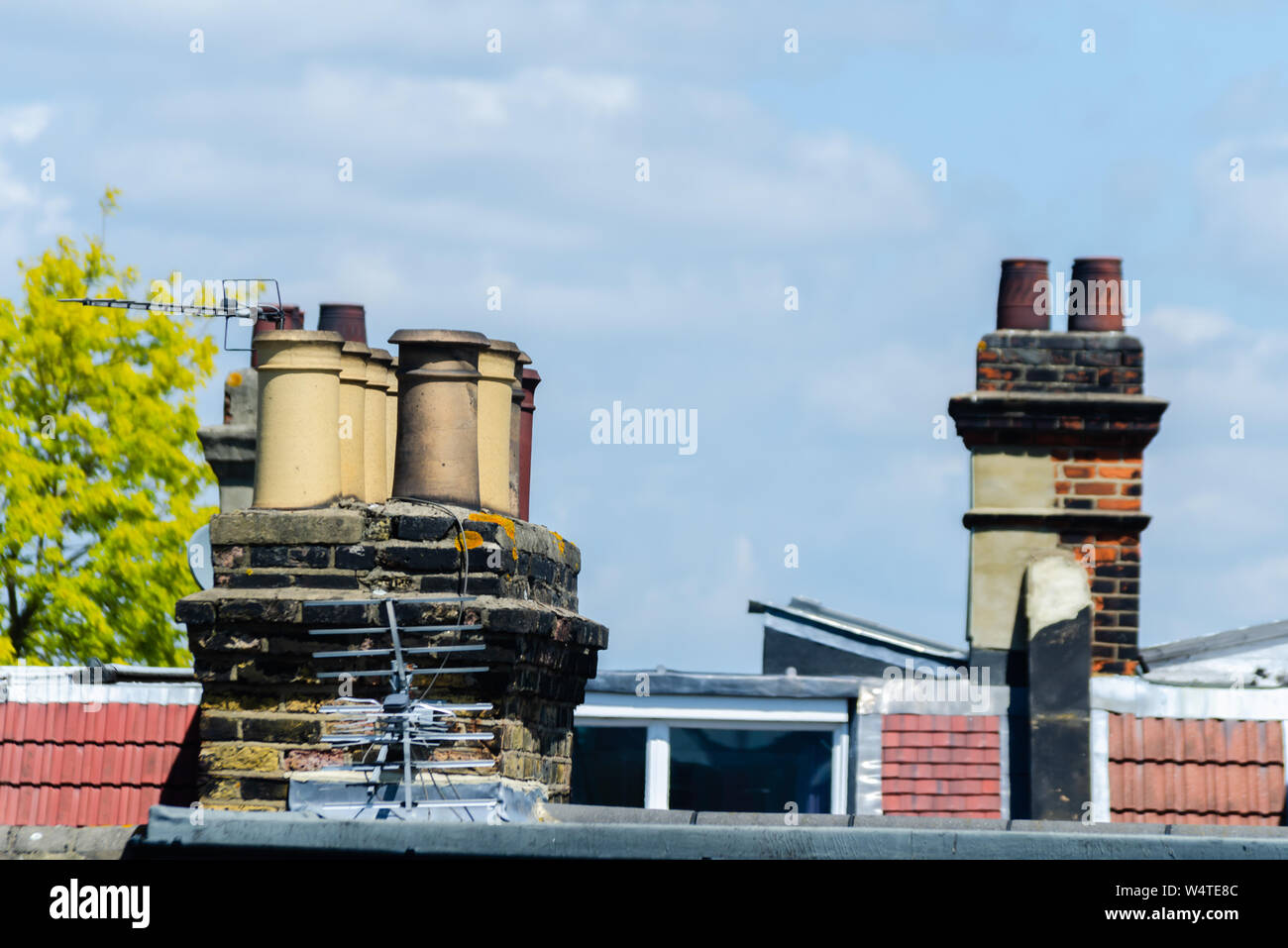 Typical English chimneys on the roofs of London buildings, an element ...