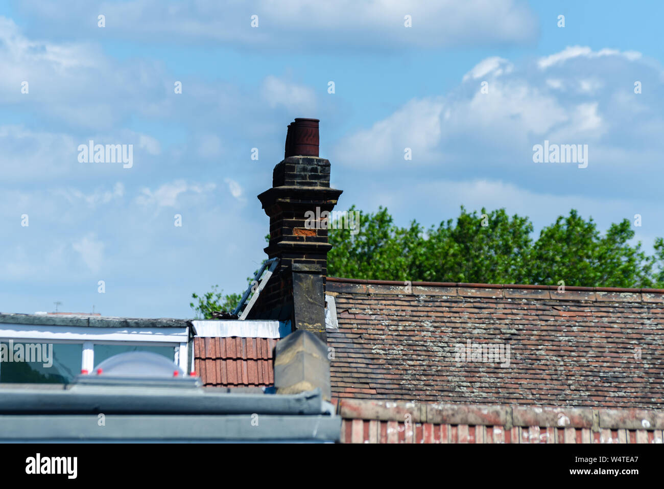 Typical English chimneys on the roofs of London buildings, an element ...
