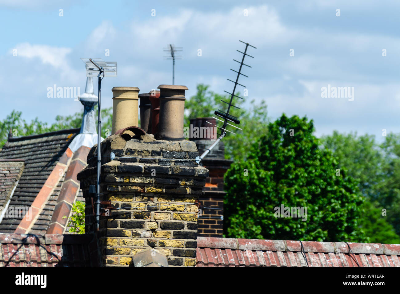 Typical English chimneys on the roofs of London buildings, an element ...