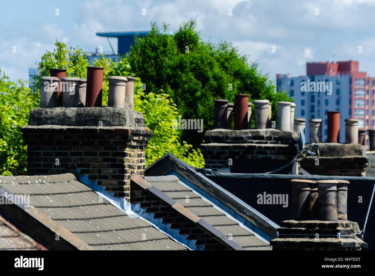 Typical English chimneys on the roofs of London buildings, an element ...