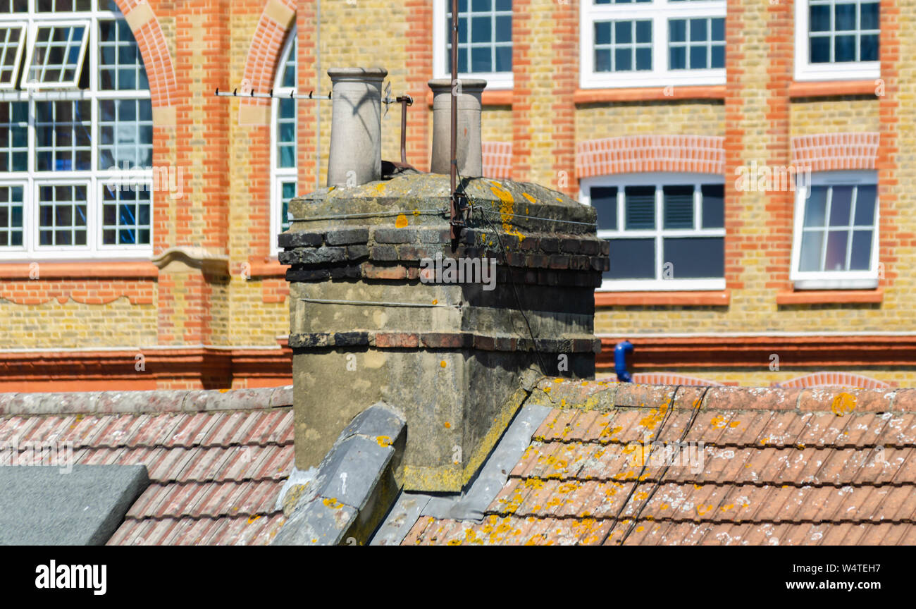 Typical English chimneys on the roofs of London buildings, an element ...