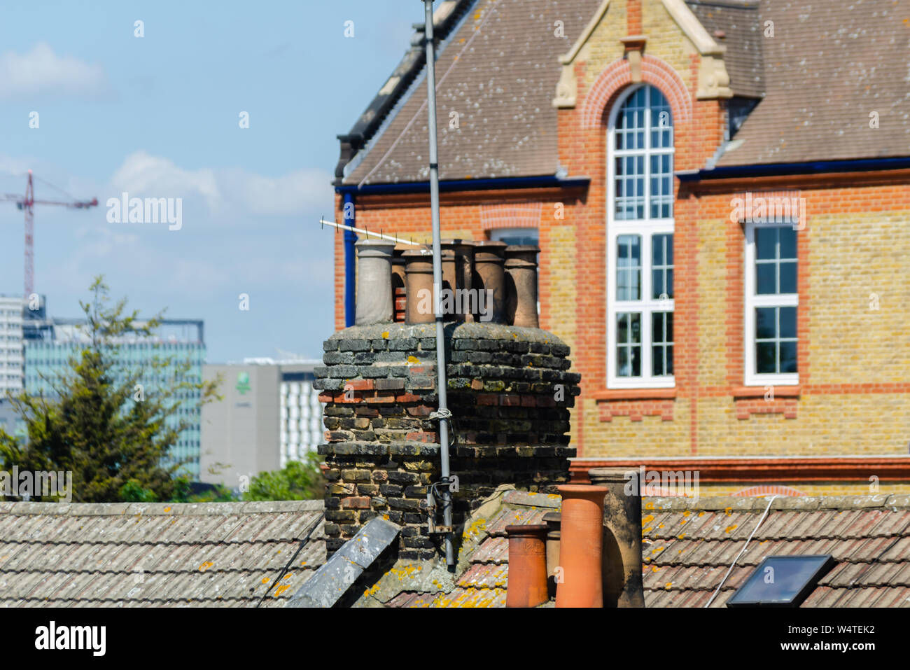 Typical English chimneys on the roofs of London buildings, an element ...