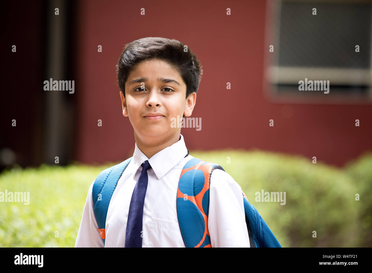 Boy school uniform bag hi-res stock photography and images - Alamy