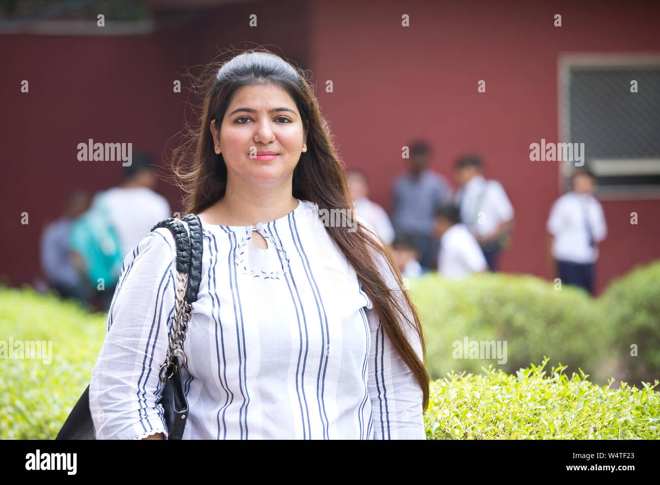 Portrait of beautiful Indian woman smiling looking at camera Stock ...