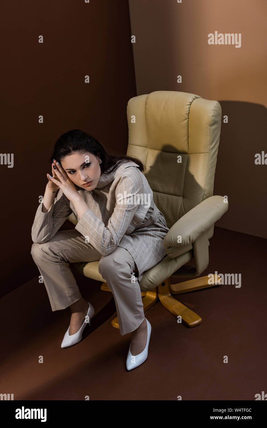 Model sitting on chair hi-res stock photography and images - Alamy