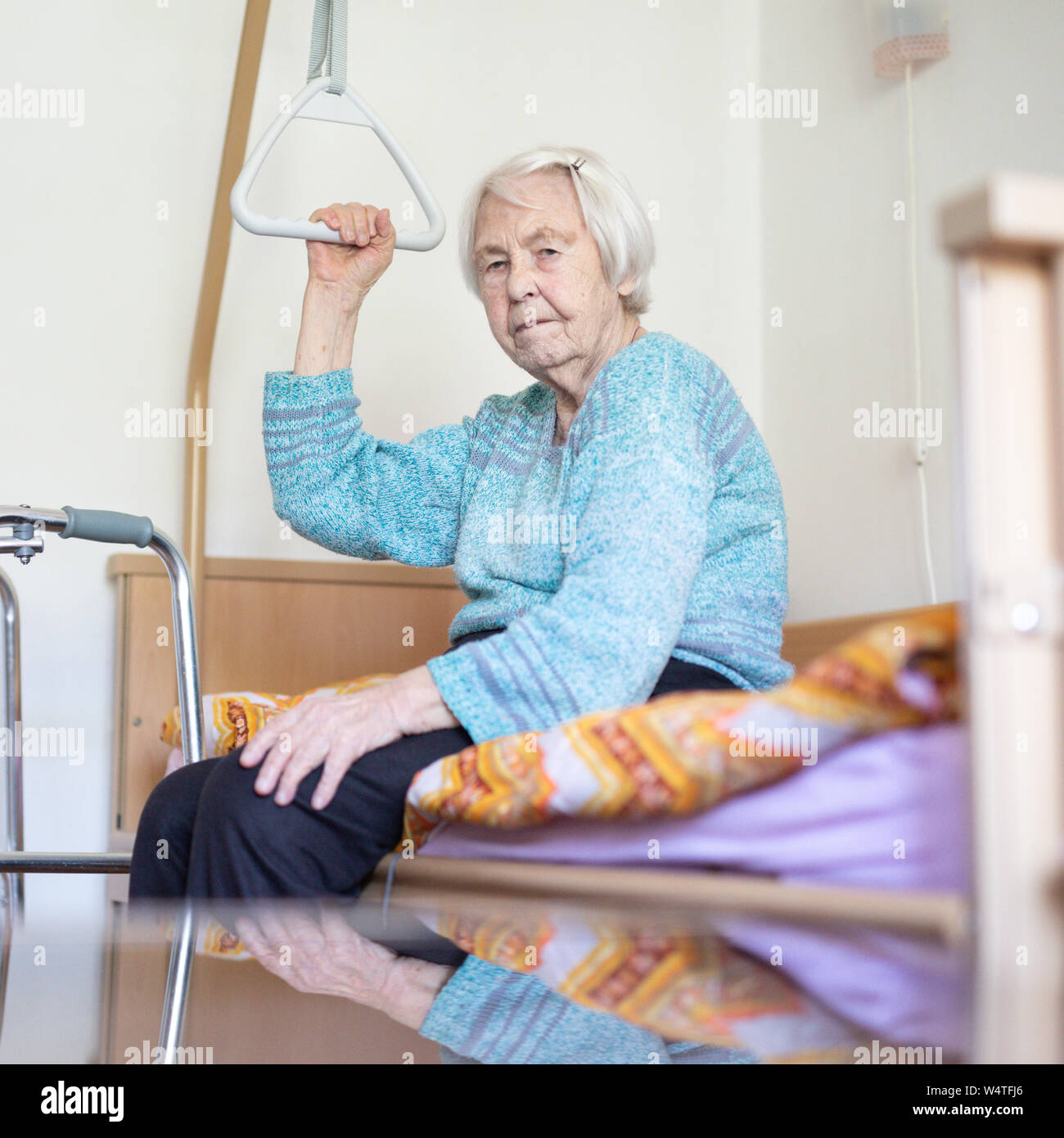 Elderly 96 years old woman sitting on medical bed in hospic Stock Photo ...