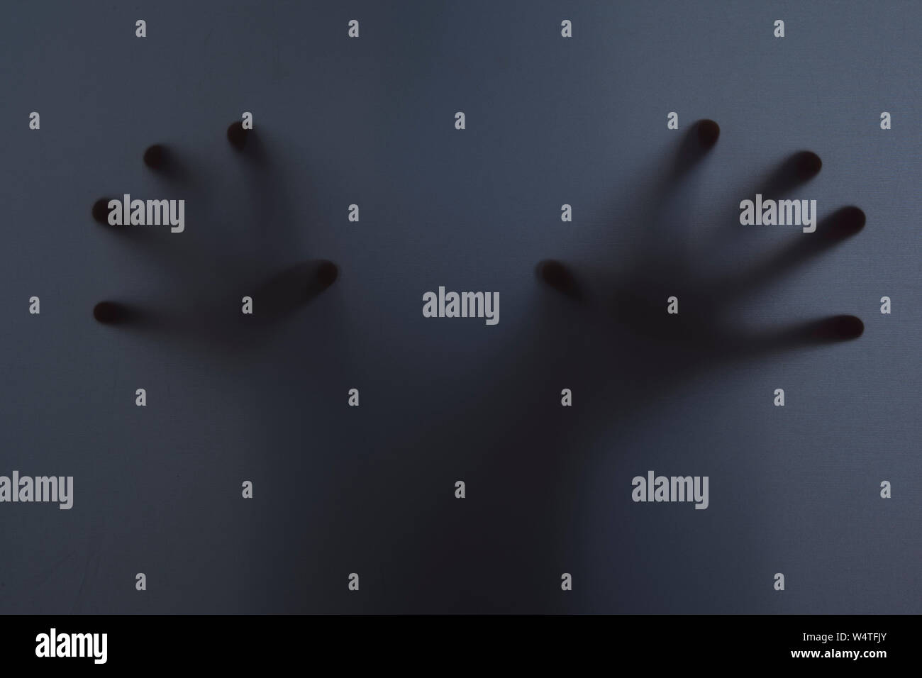 Shadowy figure behind glass / fear, panic concept Stock Photo - Alamy