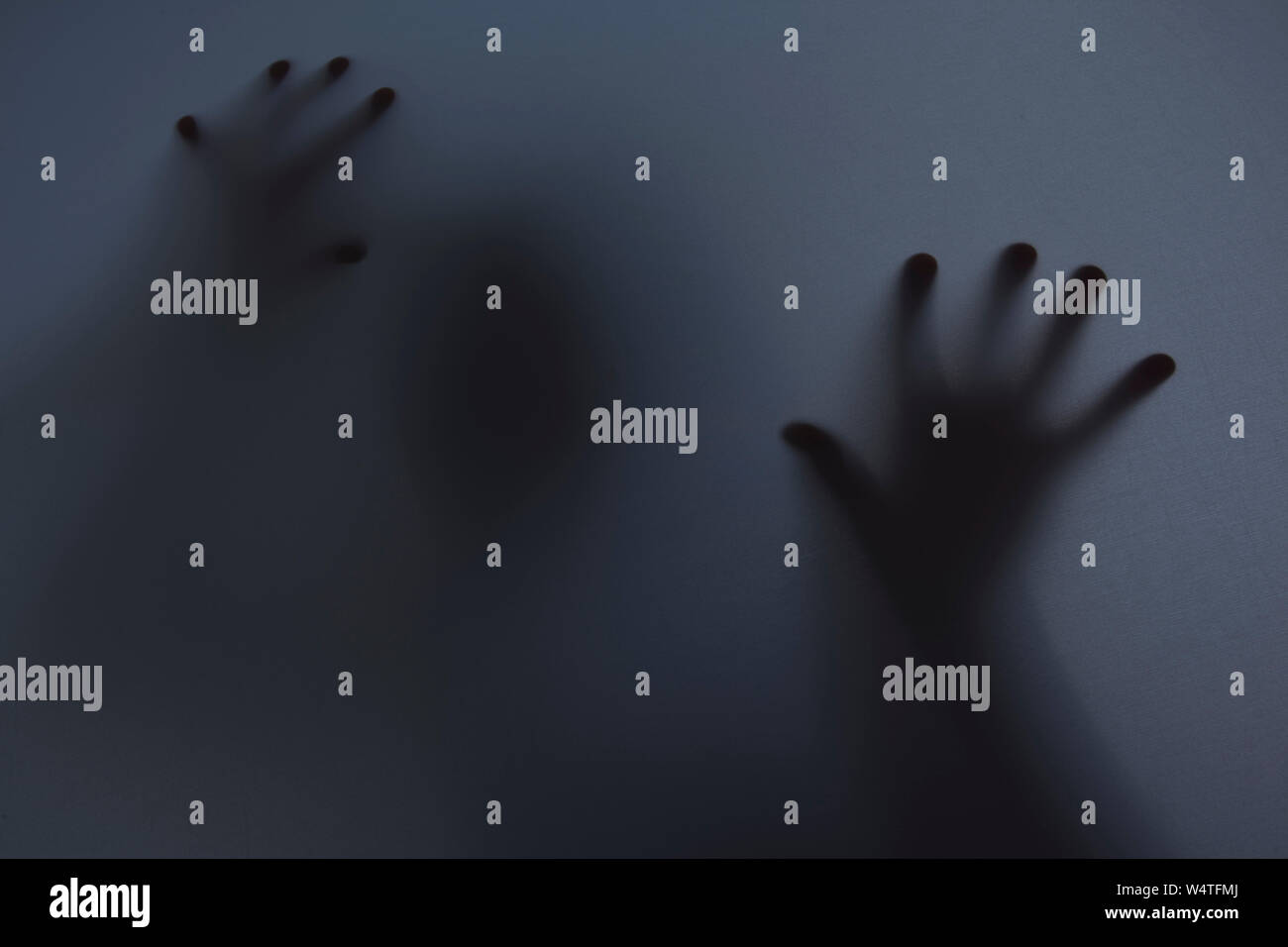 Shadowy figure behind glass / fear, panic concept Stock Photo - Alamy