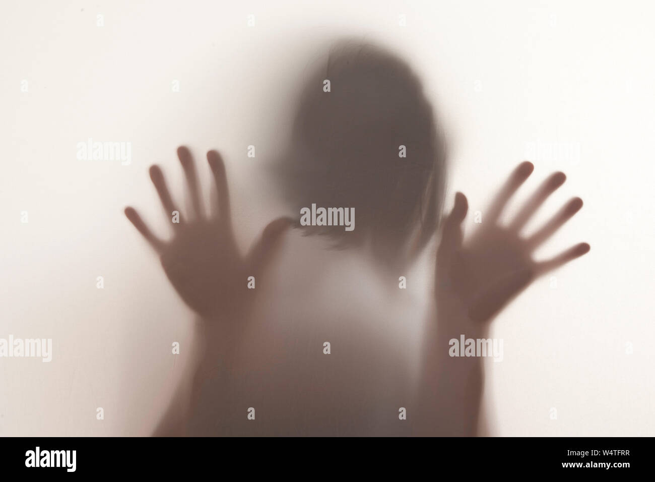 Shadowy figure behind glass / fear, panic concept Stock Photo - Alamy