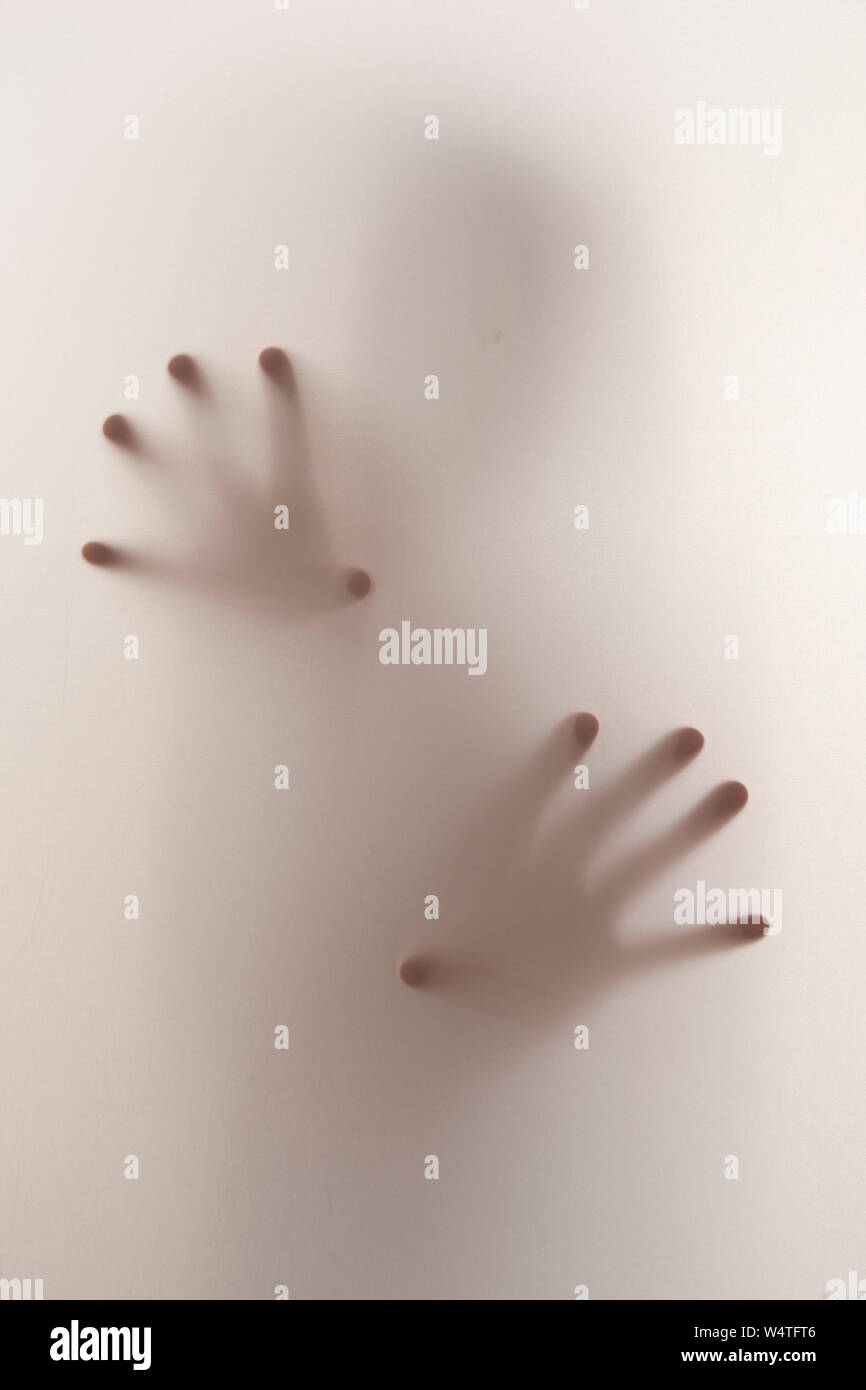 Shadowy figure behind glass / fear, panic concept Stock Photo - Alamy