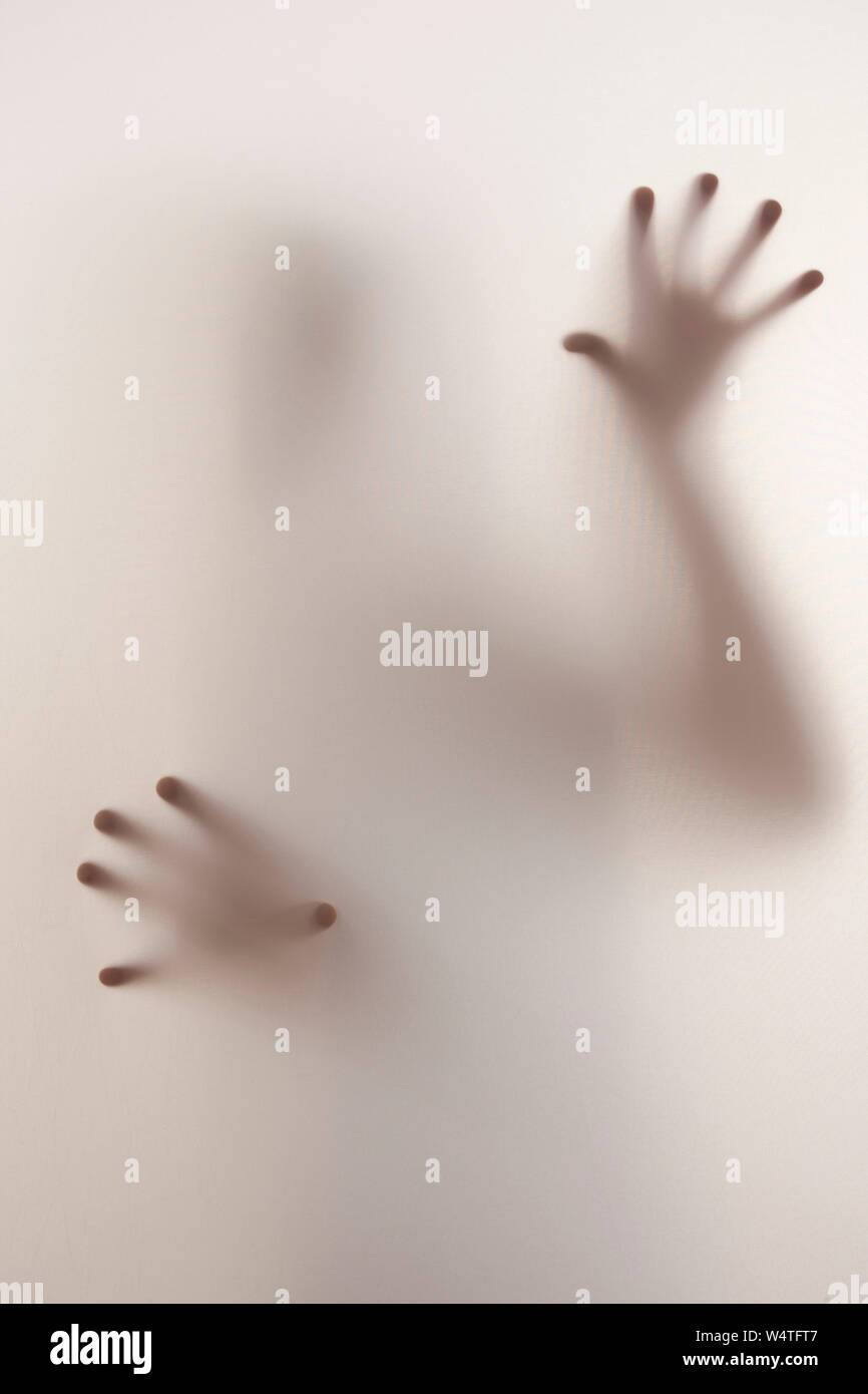 Shadowy figure behind glass / fear, panic concept Stock Photo - Alamy