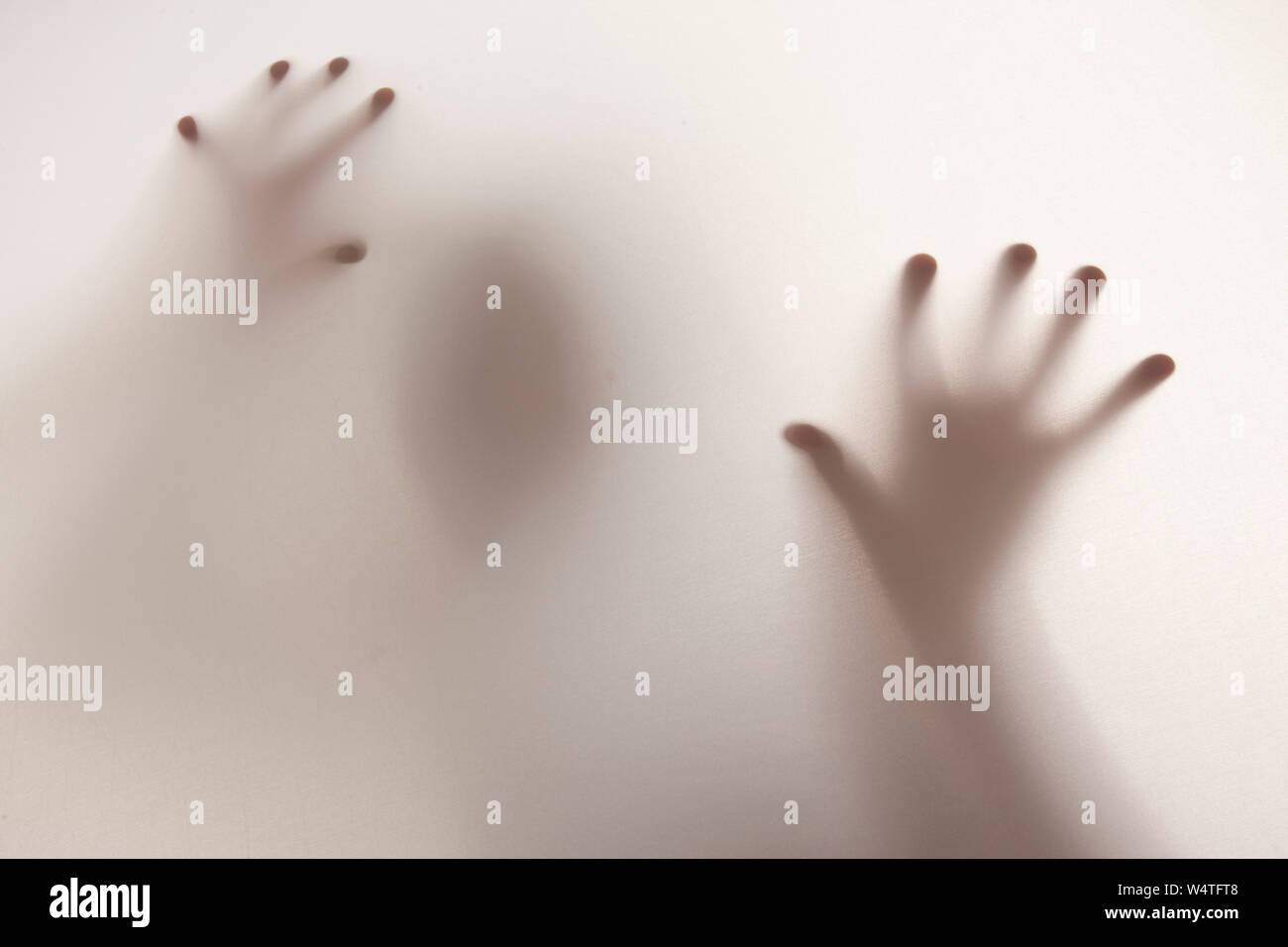 Shadowy figure behind glass / fear, panic concept Stock Photo - Alamy
