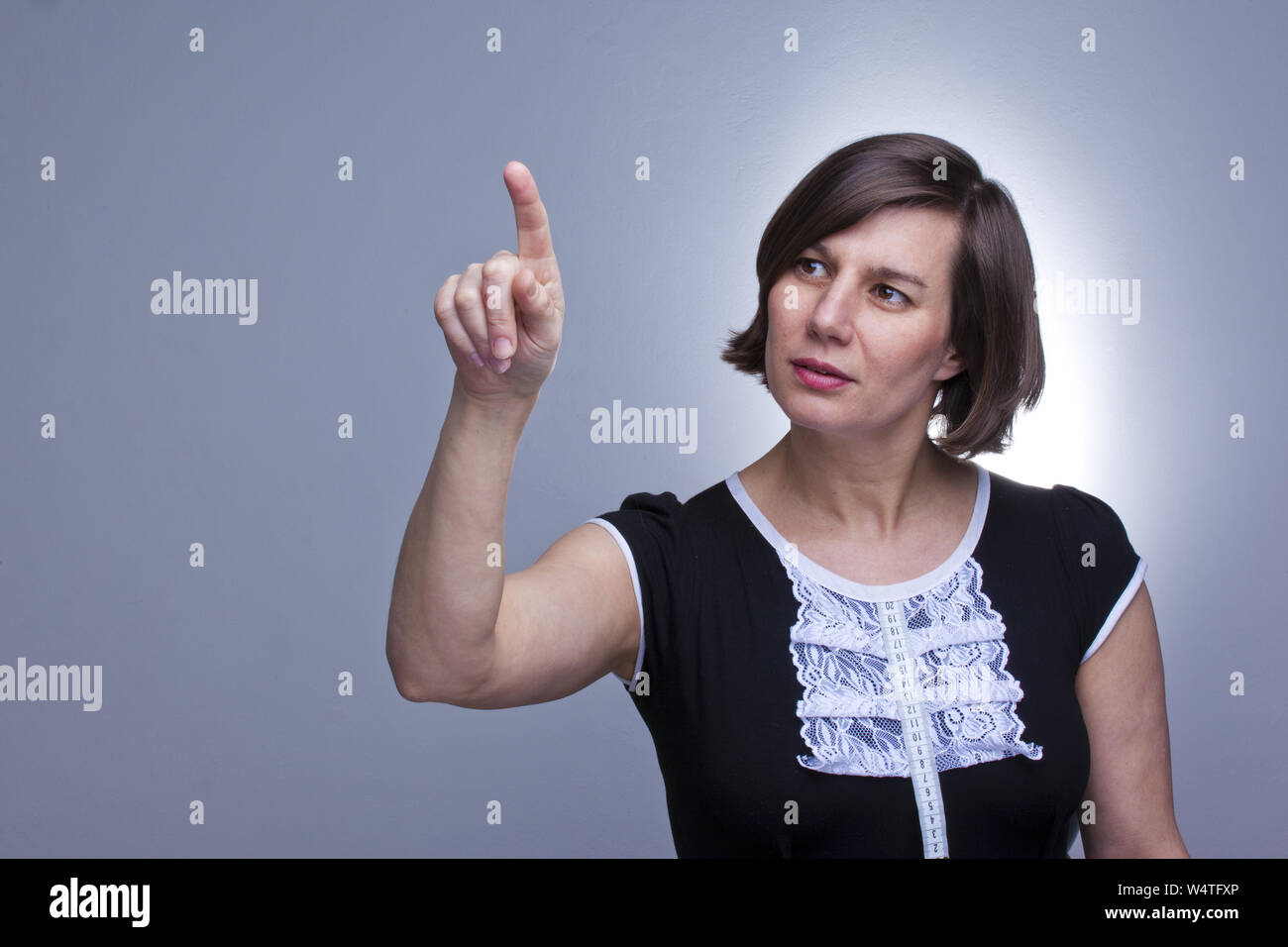 Women touching the screen on white background Stock Photo - Alamy