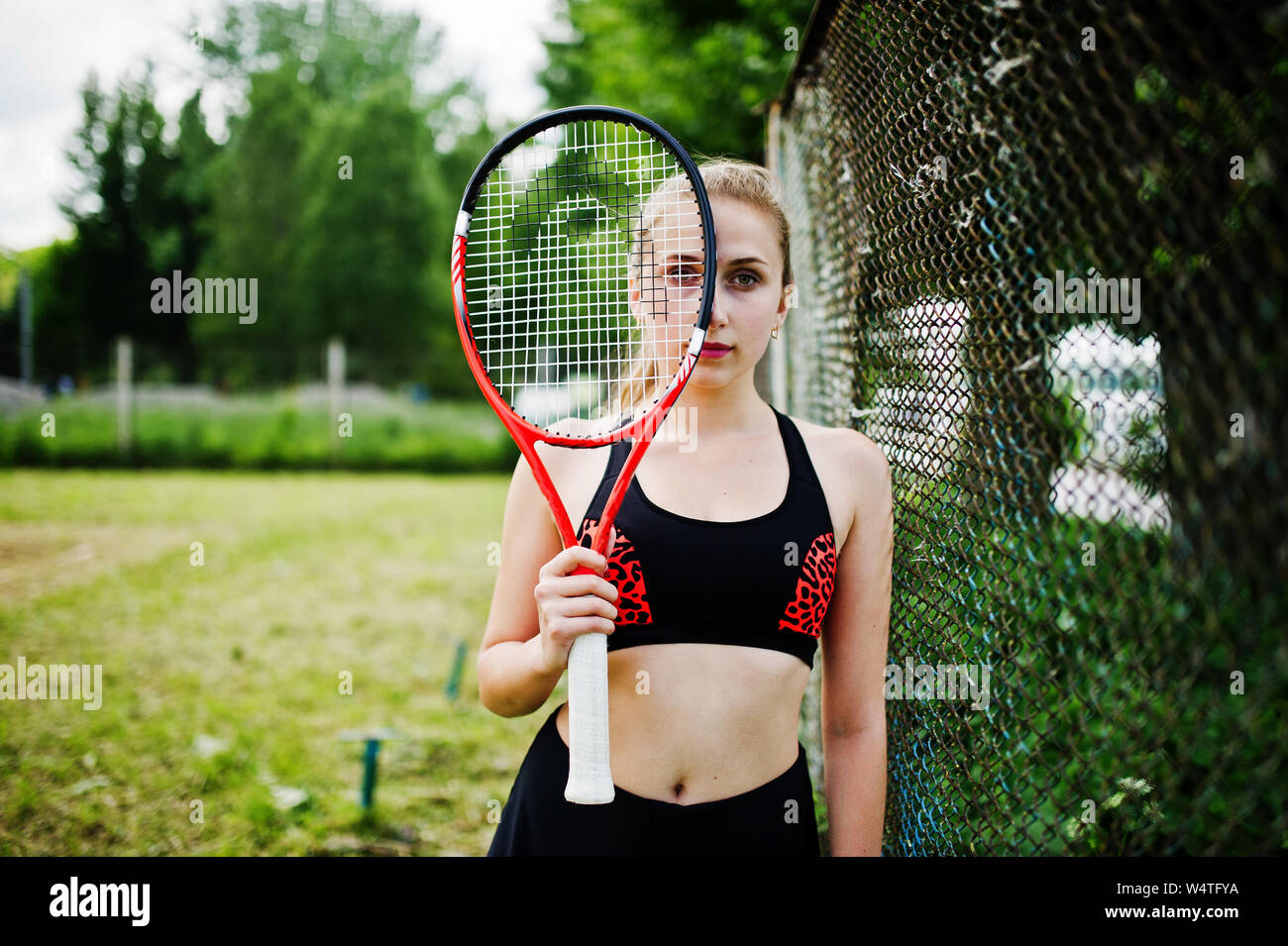 Beautiful sport woman tennis player with racket in sportswear costume ...