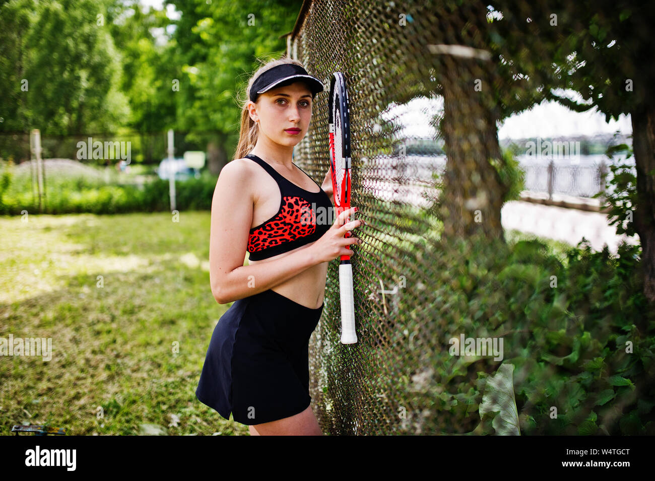Beautiful sport woman tennis player with racket in sportswear costume ...