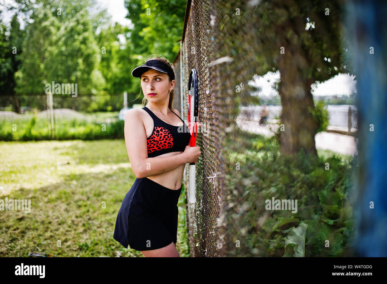 Beautiful sport woman tennis player with racket in sportswear costume ...
