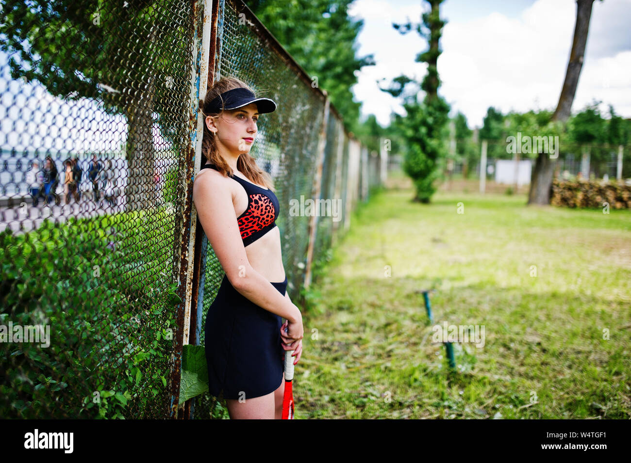 Beautiful sport woman tennis player with racket in sportswear costume ...