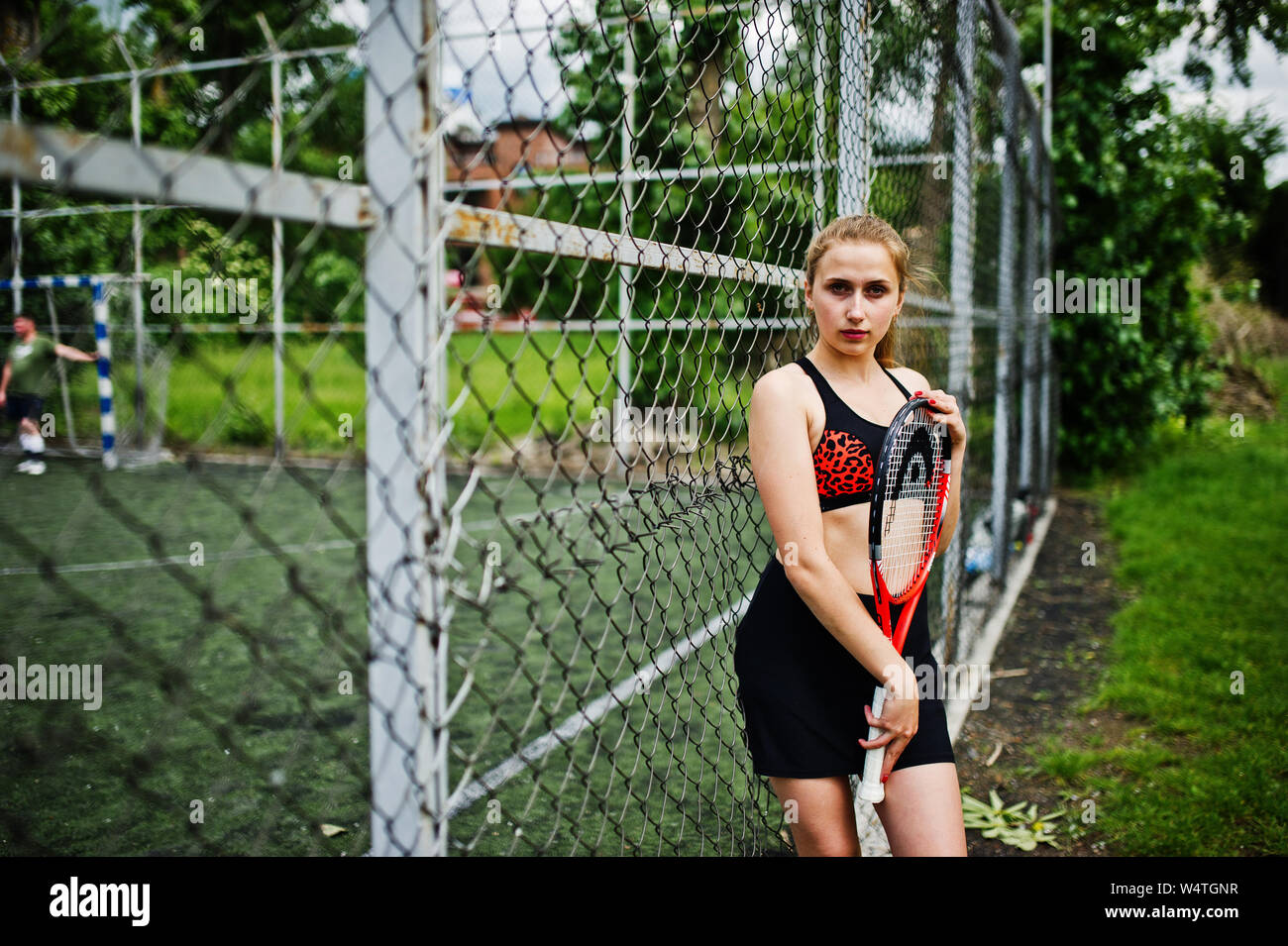 Beautiful sport woman tennis player with racket in sportswear costume ...