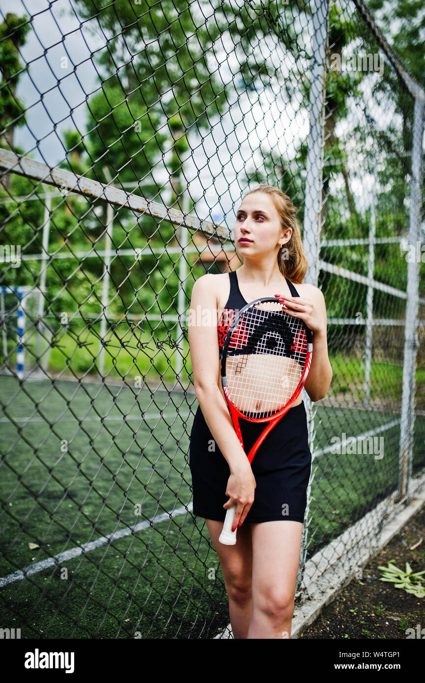 Beautiful sport woman tennis player with racket in sportswear costume ...