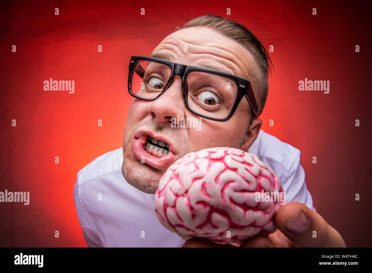 Crazy teacher or scientist with brain Stock Photo - Alamy