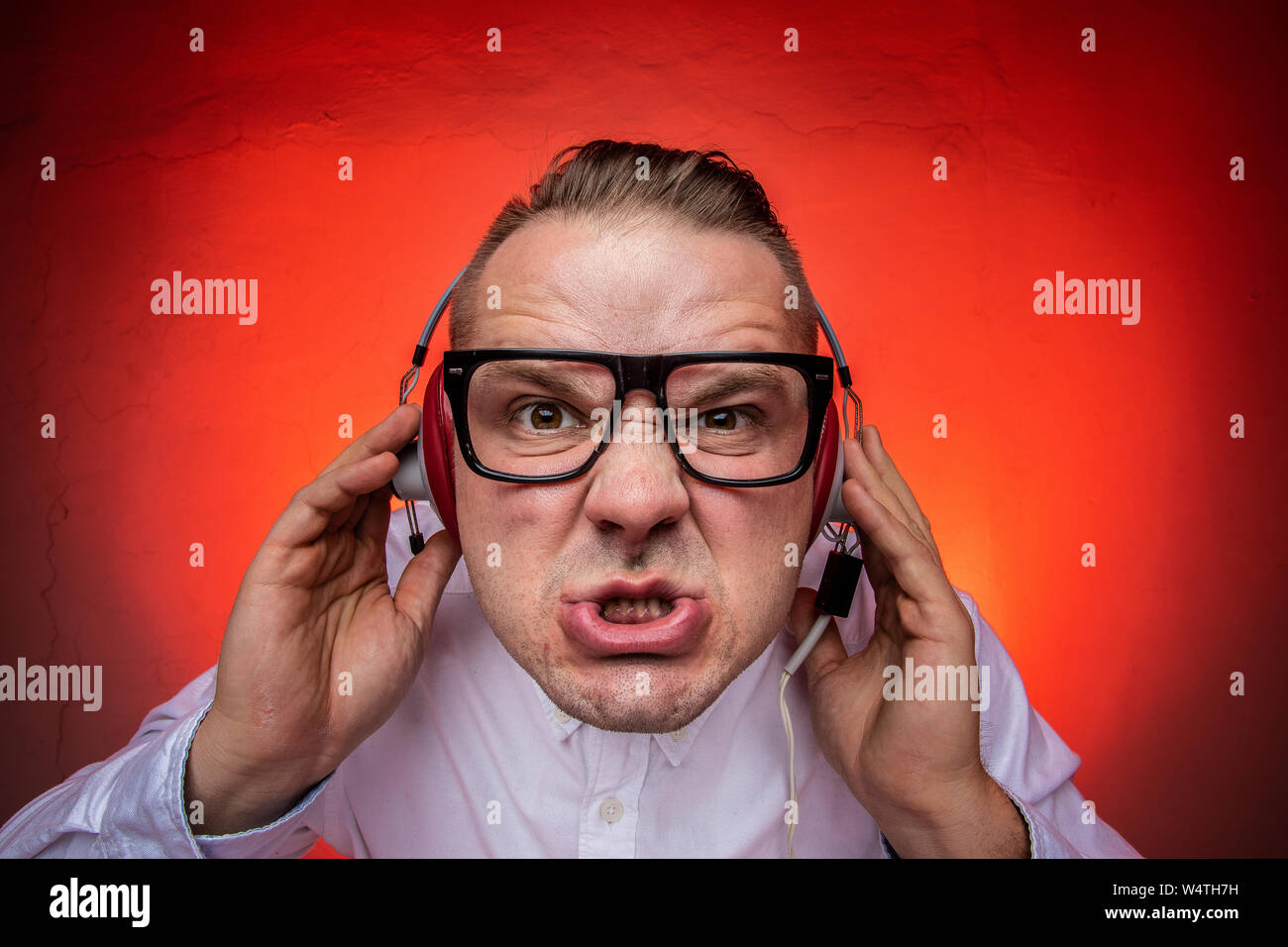 Man enjoys loud music in the headphones Stock Photo - Alamy