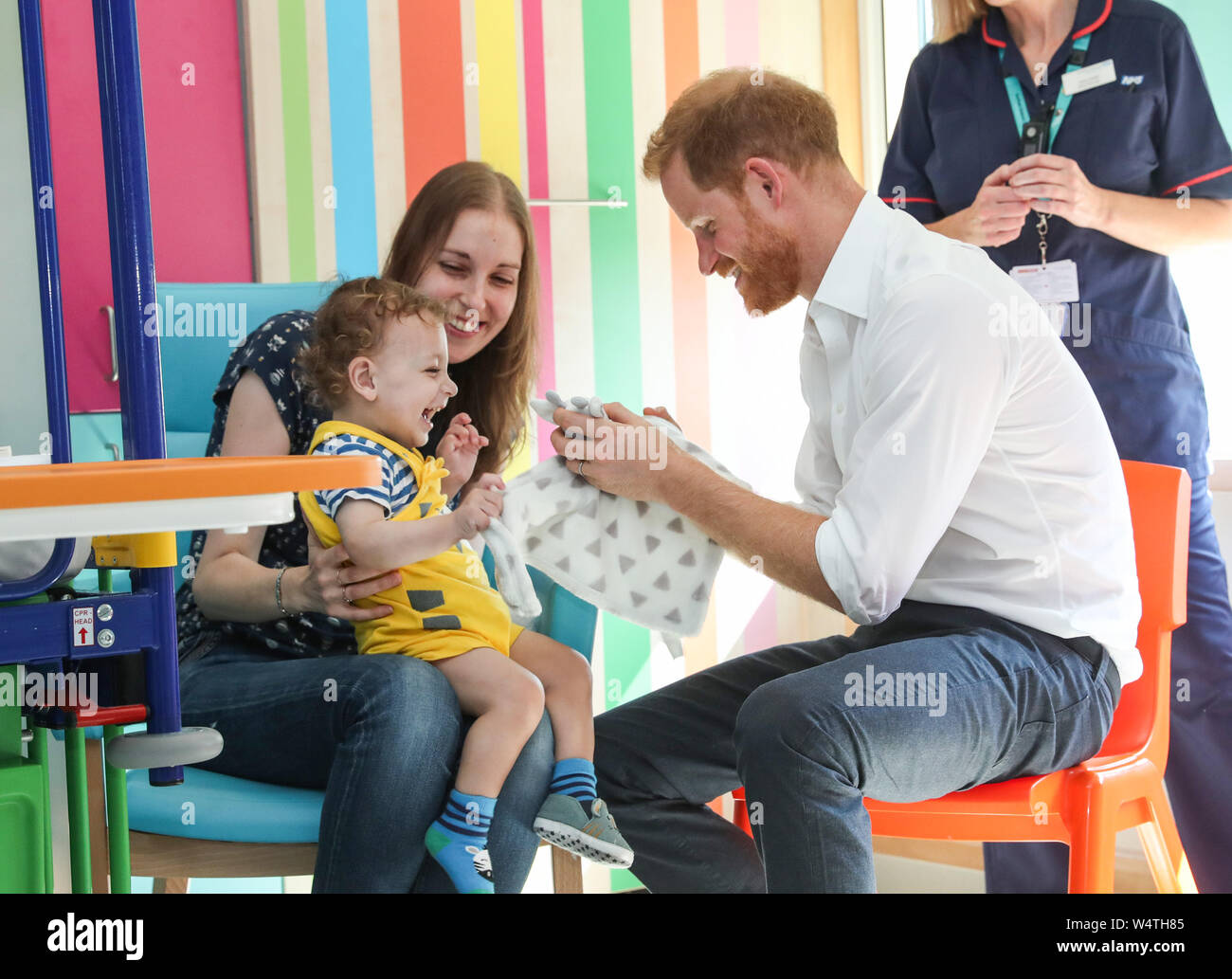 The Duke of Sussex plays with one year old Noah Nicholson during his ...