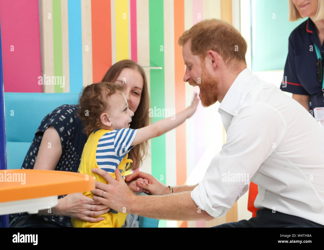 The Duke of Sussex plays with one year old Noah Nicholson during his ...