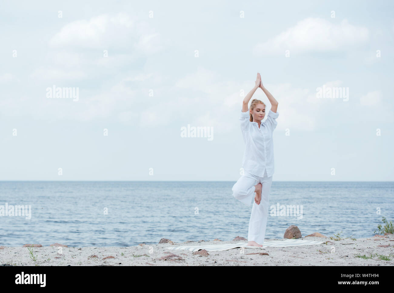 Woman praying near water hi-res stock photography and images - Alamy