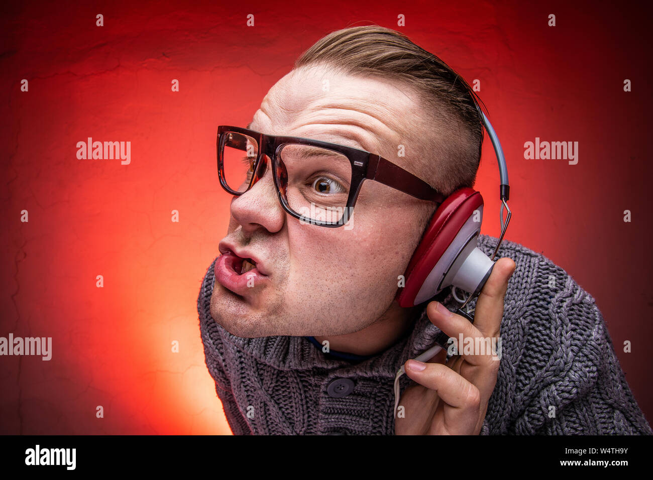 Man enjoys loud music in the headphones Stock Photo - Alamy