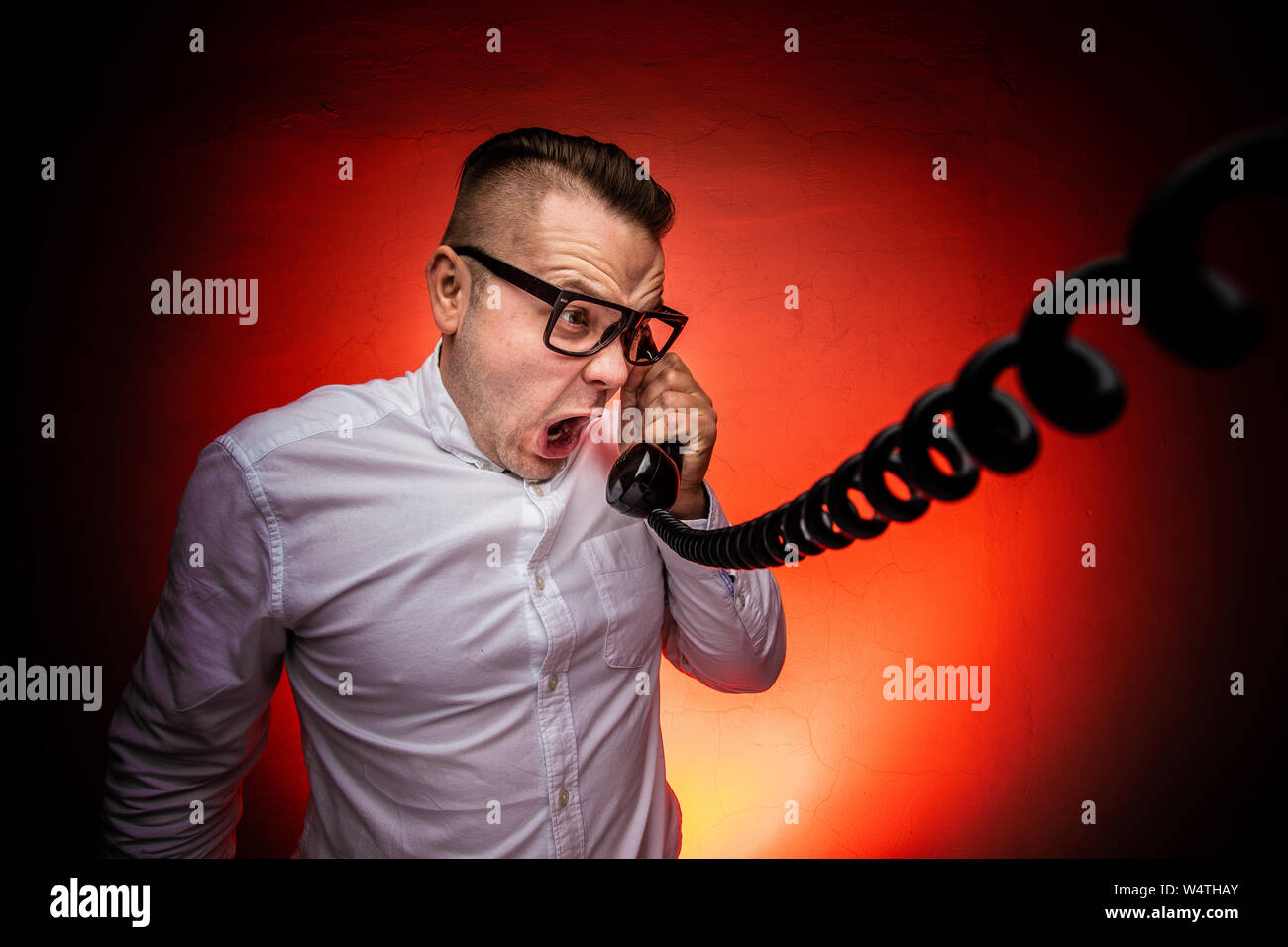 Hysterical and crazy boss screaming on the phone. Bad boss concept ...