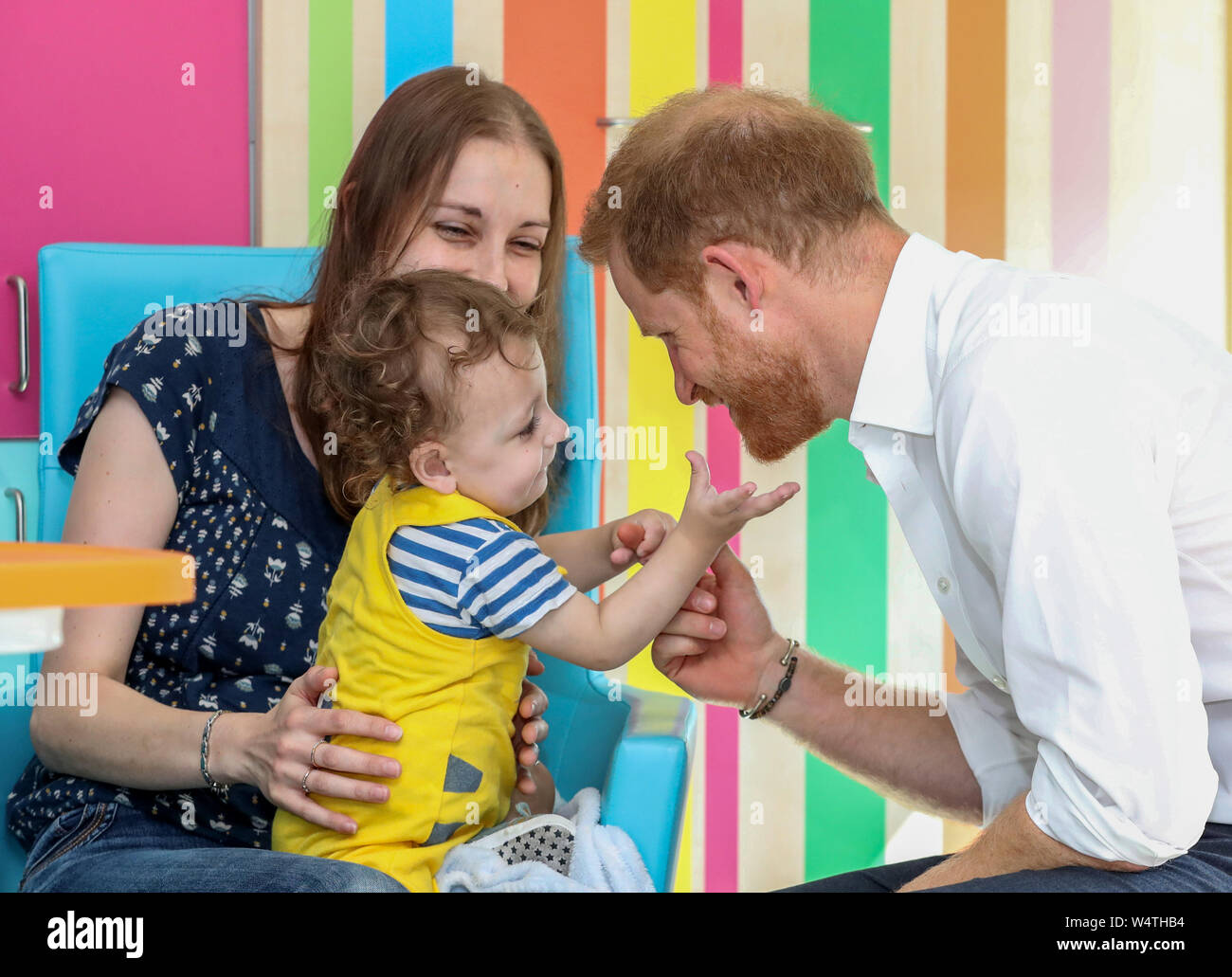The Duke of Sussex plays with one year old Noah Nicholson during his ...