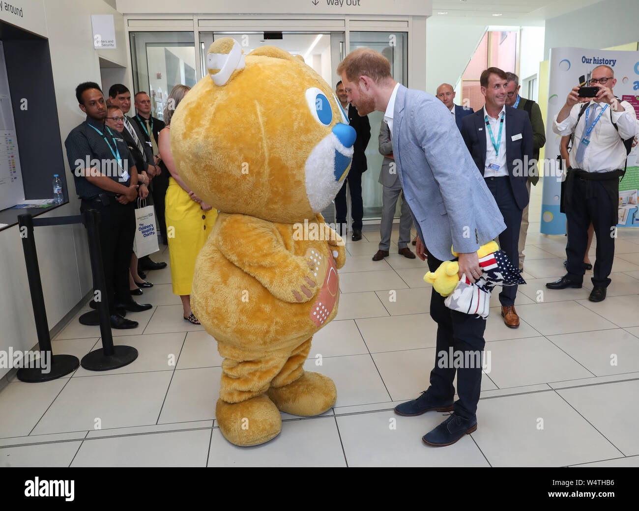 The Duke of Sussex meets the hospital's mascot, Theo the bear, during ...