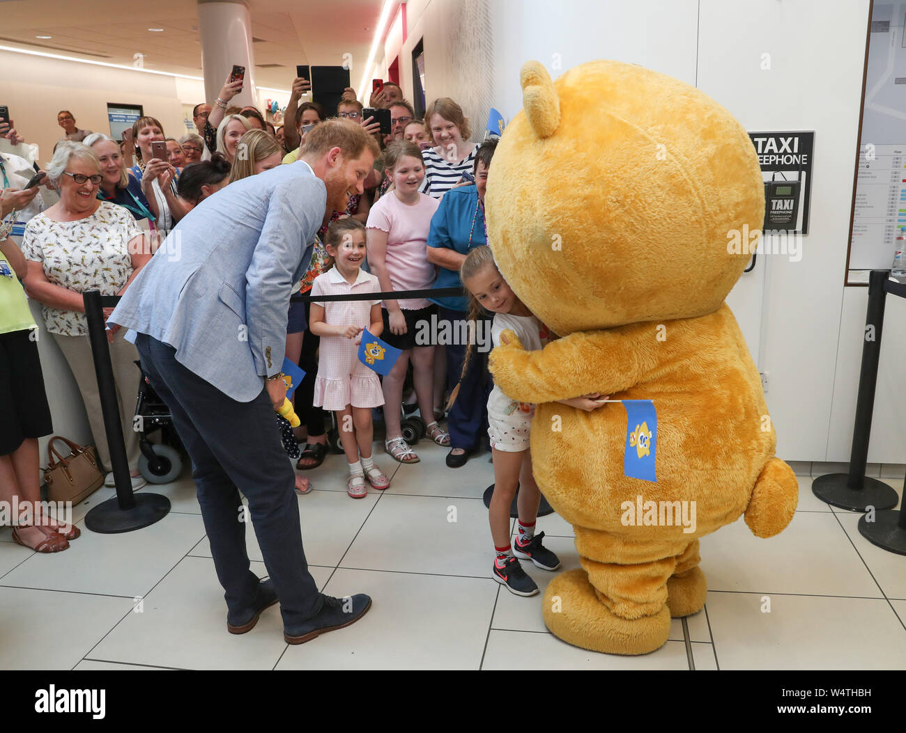 The Duke of Sussex meets the hospital's mascot, Theo the bear, during ...