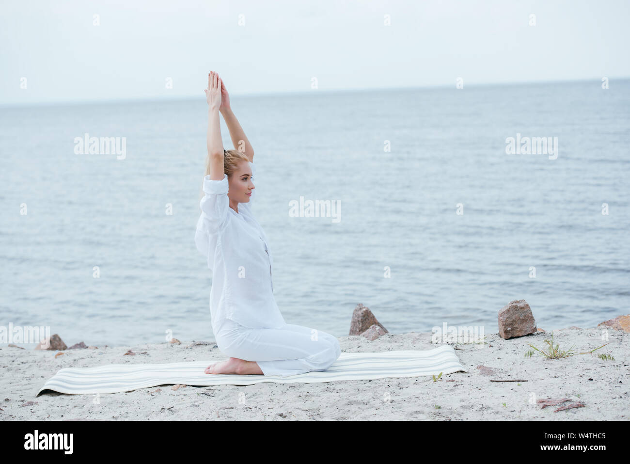 Woman praying near water hi-res stock photography and images - Alamy