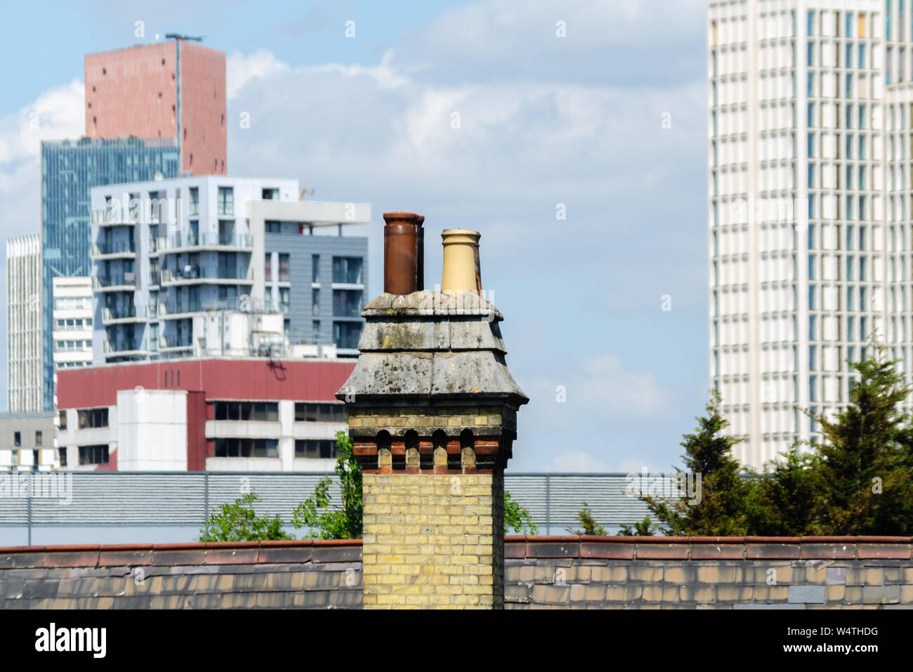 Typical English chimneys on the roofs of London buildings, an element ...