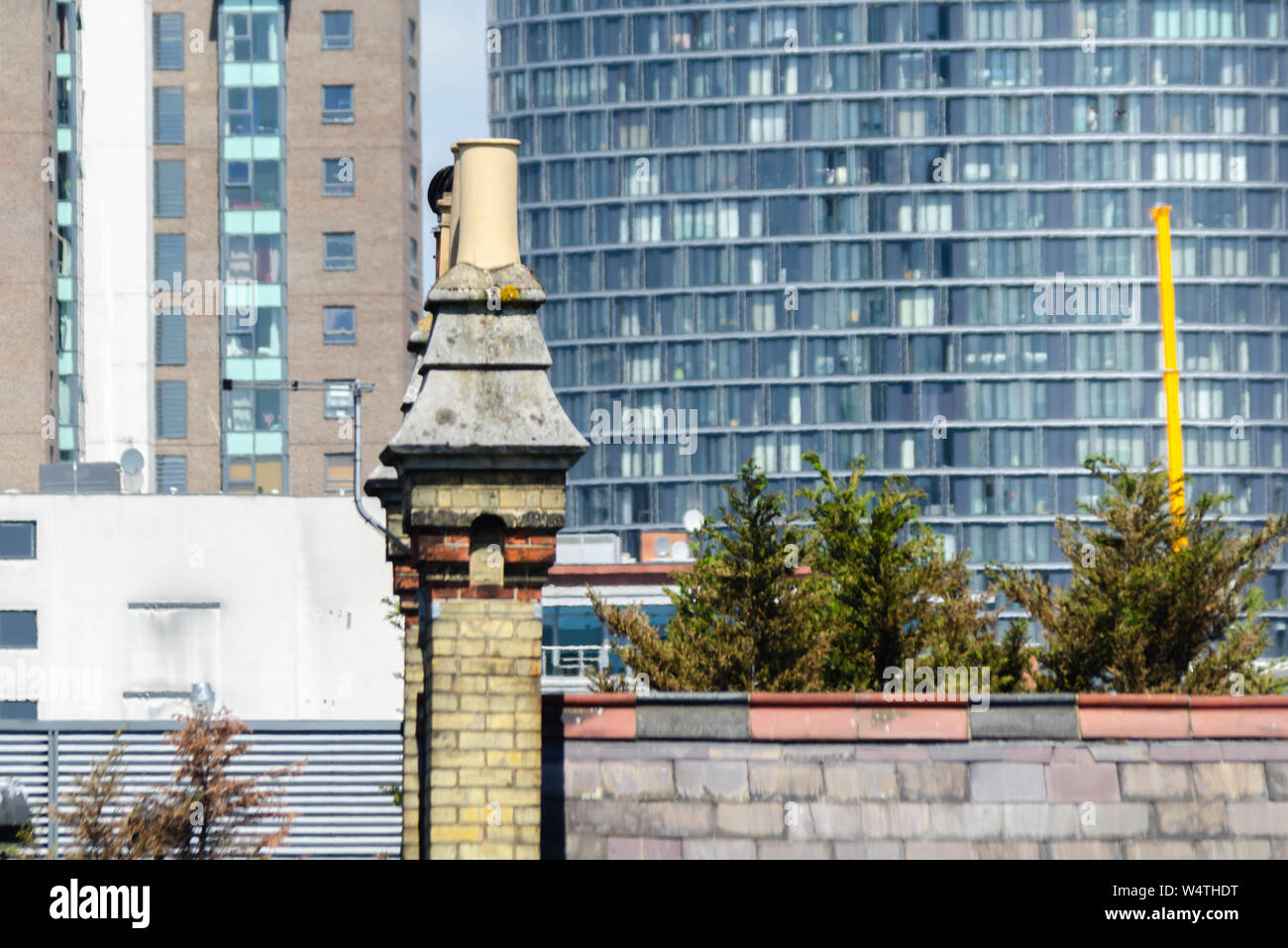 Typical English chimneys on the roofs of London buildings, an element ...