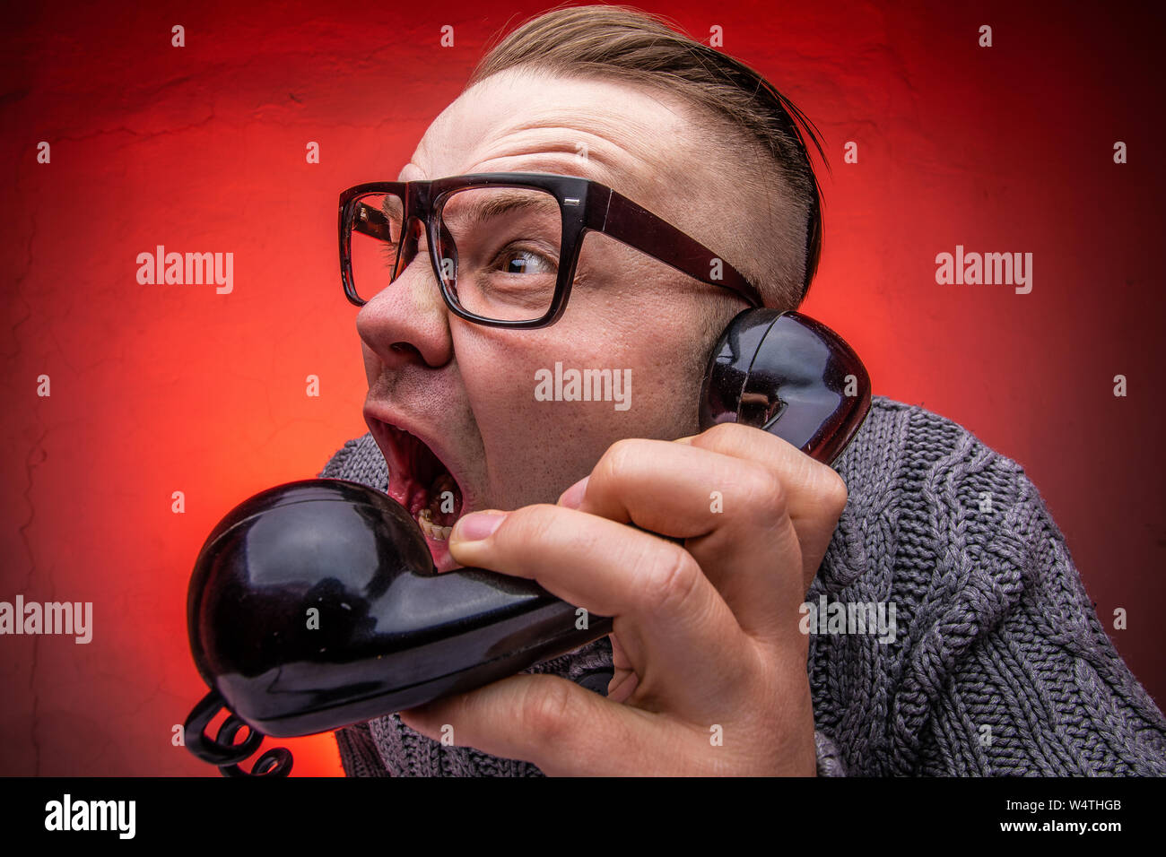 Hysterical and crazy boss screaming on the phone. Bad boss concept ...