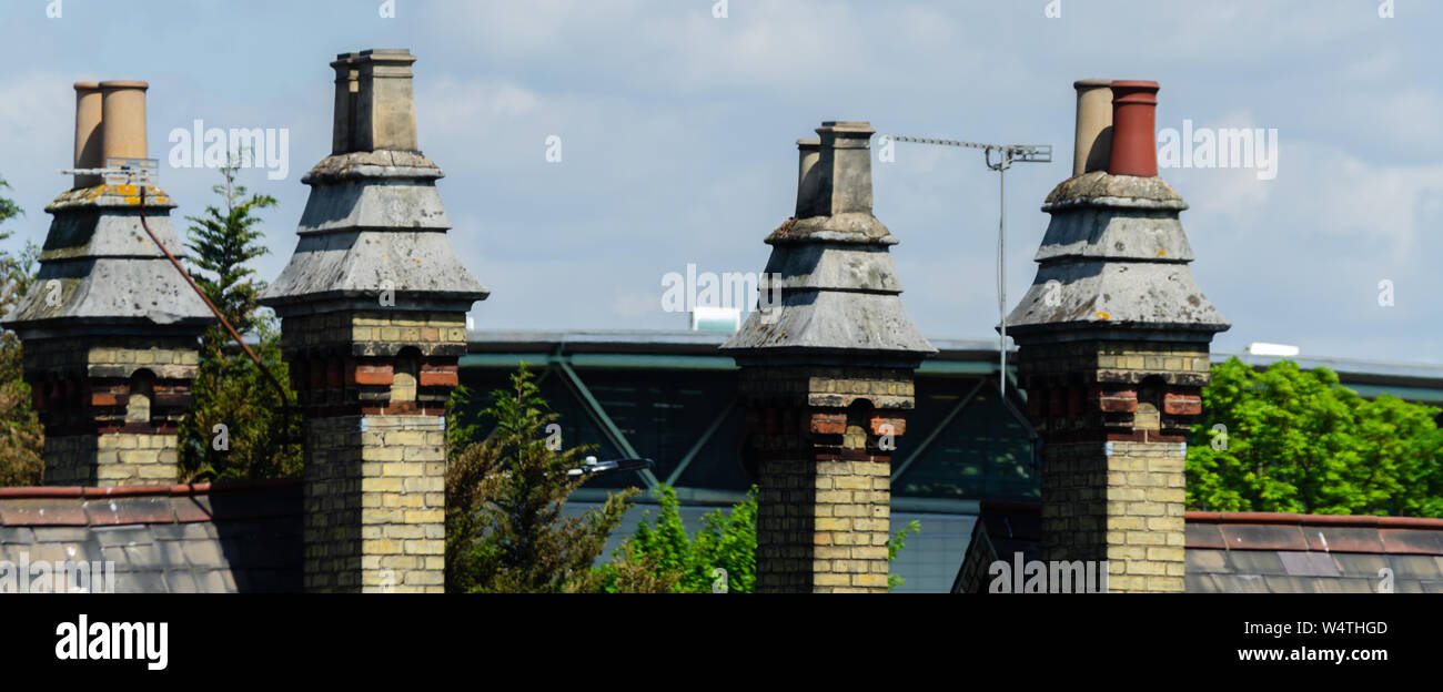 Typical English chimneys on the roofs of London buildings, an element ...