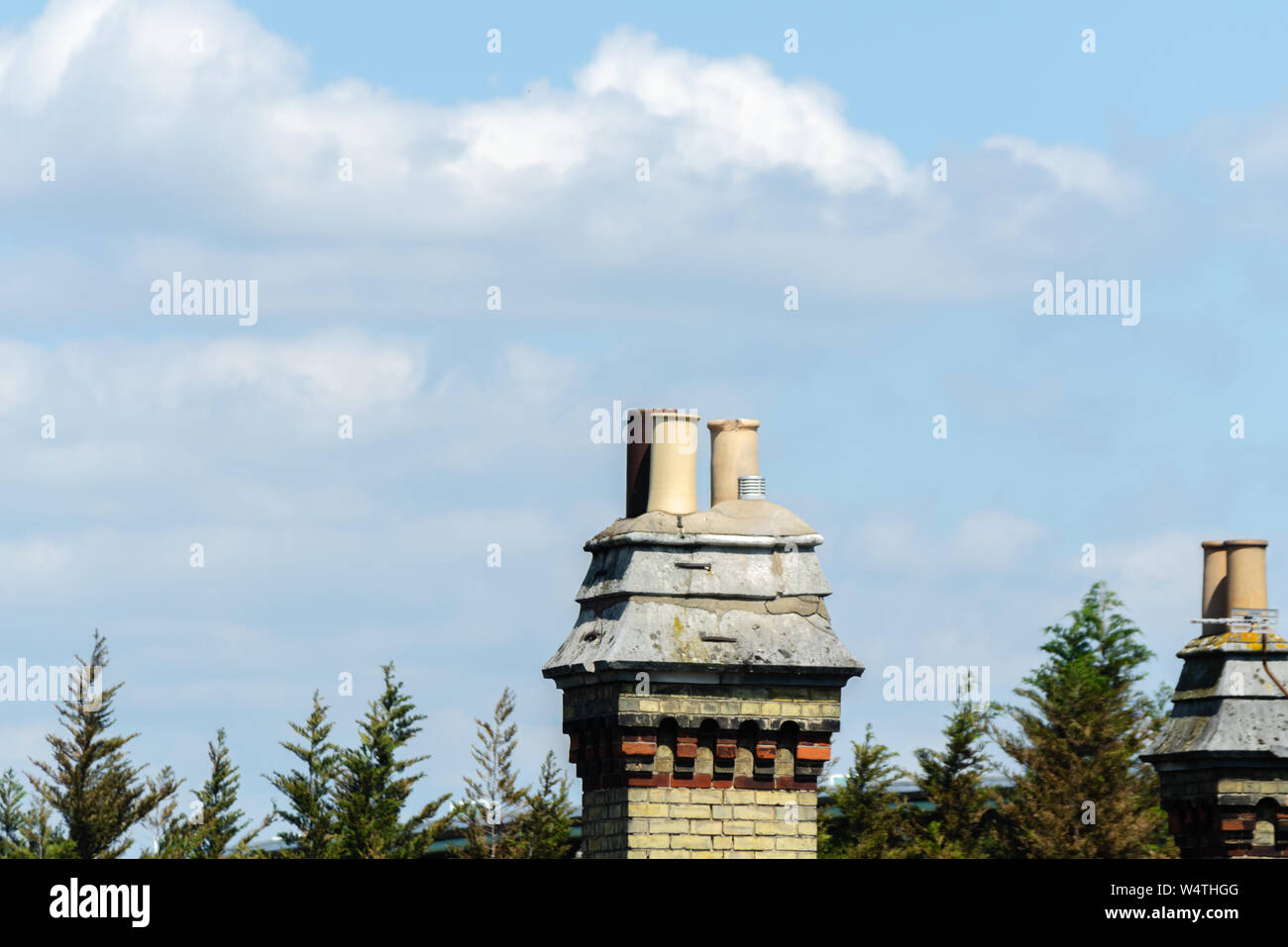 Typical English chimneys on the roofs of London buildings, an element ...