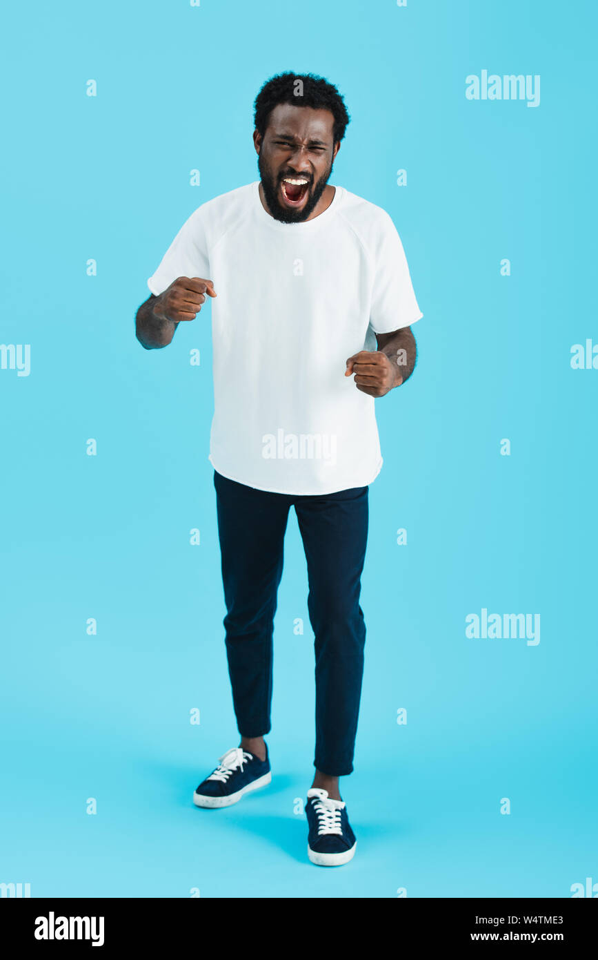 aggressive african american man shouting isolated on blue Stock Photo ...