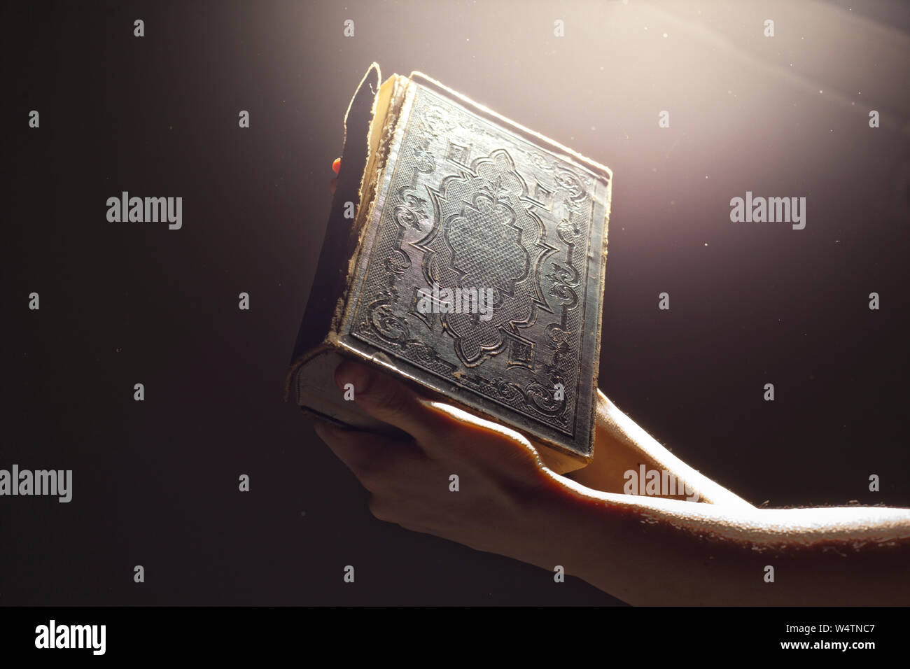 Holy Bilble in glow Stock Photo - Alamy