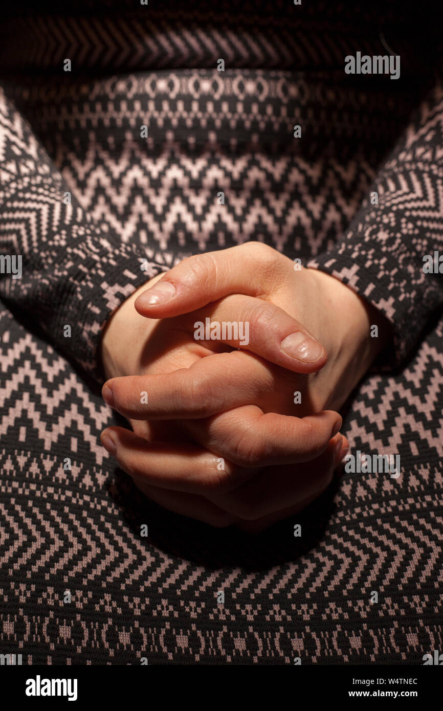 Hands folded to pray Stock Photo - Alamy