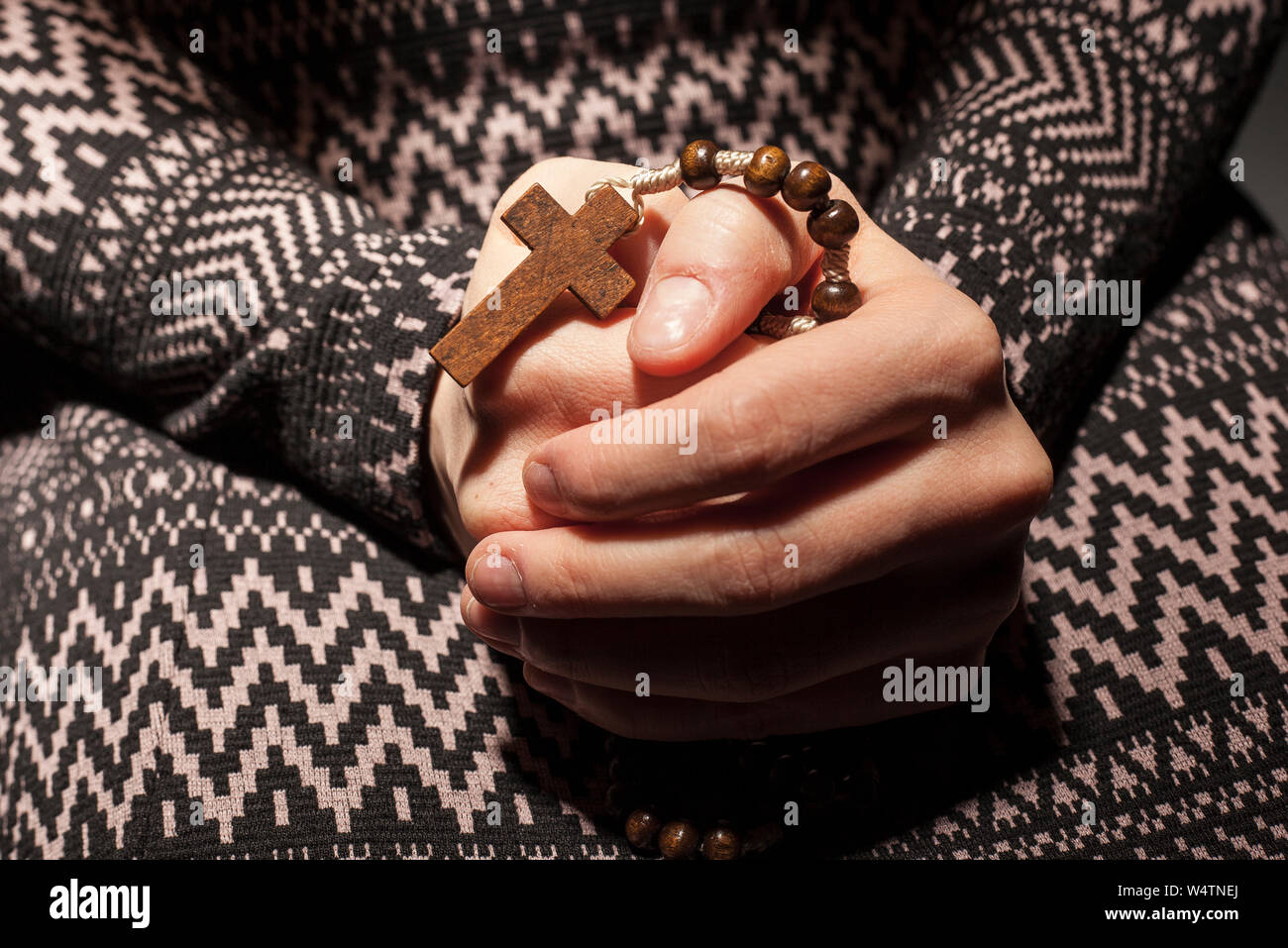 Hands folded to pray Stock Photo - Alamy