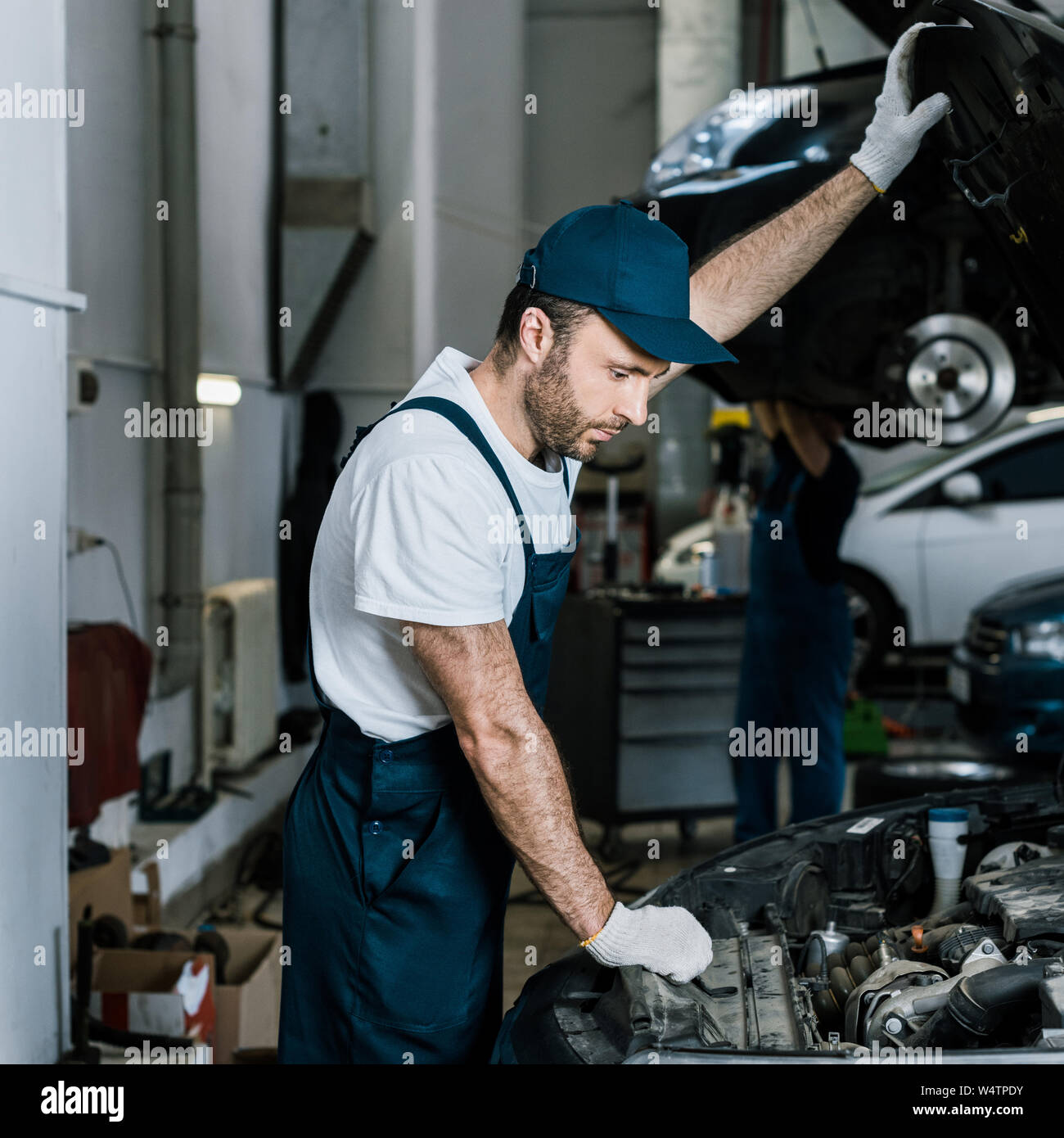 Bearded mechanic in car repair hi-res stock photography and images - Alamy