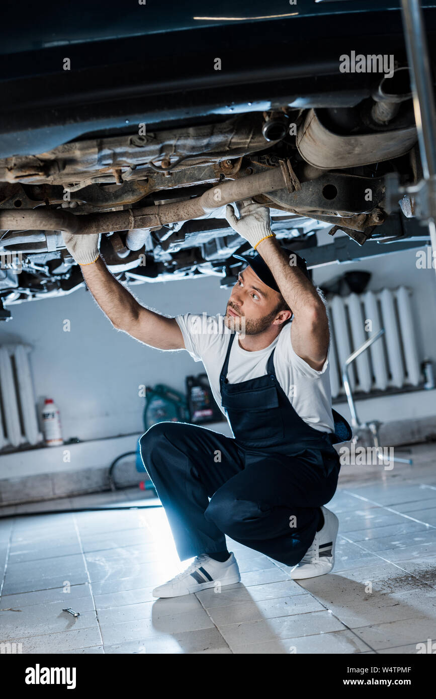 Handsome bearded mechanic repairing hi-res stock photography and images ...
