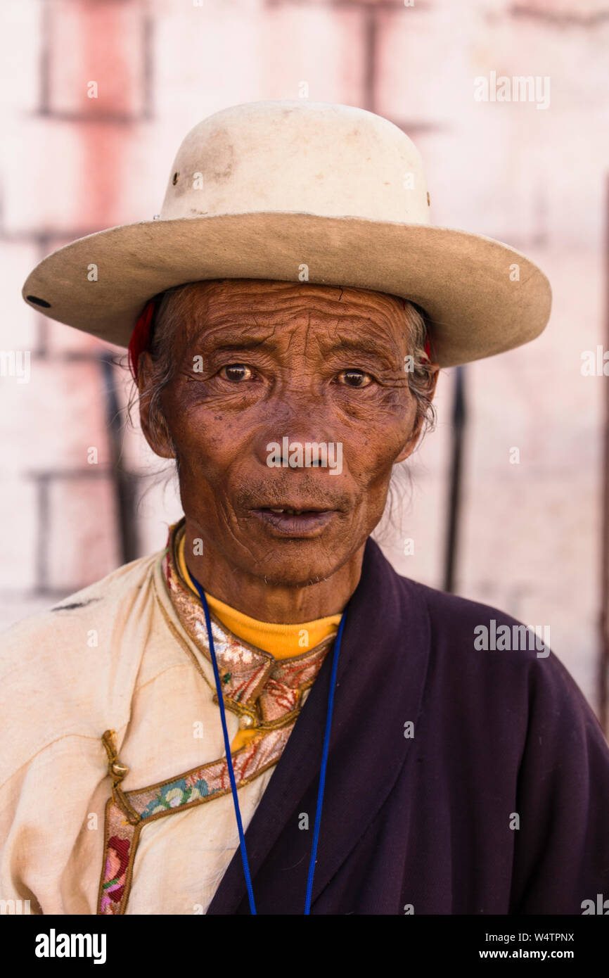 China, Tibet, Lhasa, A Tibetan Buddhist pilgrim from the Kham region of ...