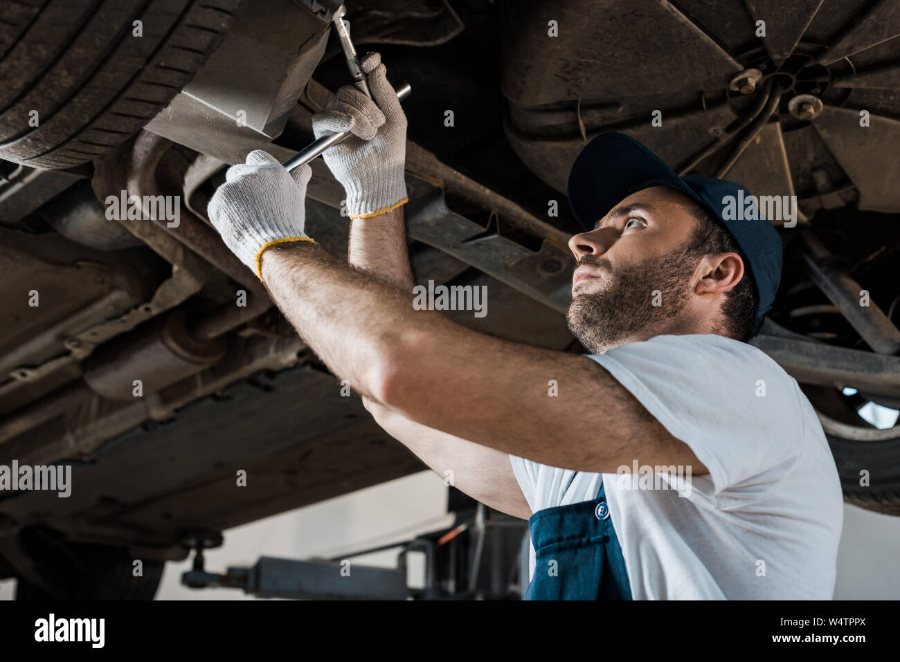 Bearded man mechanic repairing car hi-res stock photography and images ...