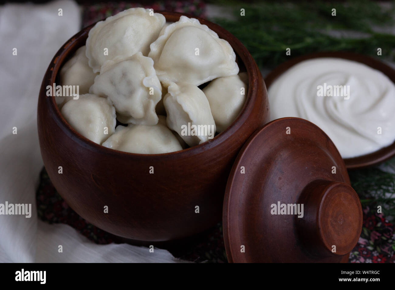 Cooked russian pelmeni meat dumplings in the clay pot Stock Photo - Alamy